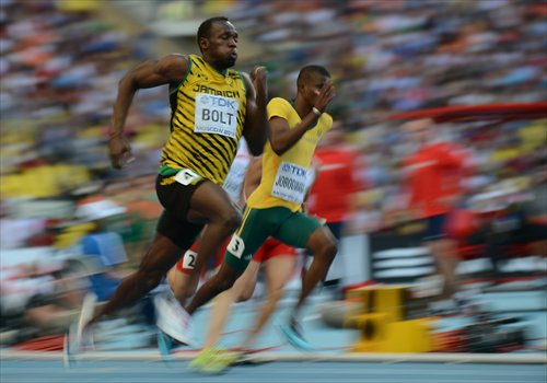 Bolt coasts into 200 meters final in search of third title - Global Times