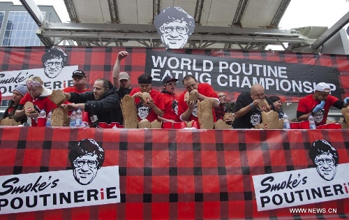 Man wins title in eating contest after gobbling 48 boxes of poutine ...