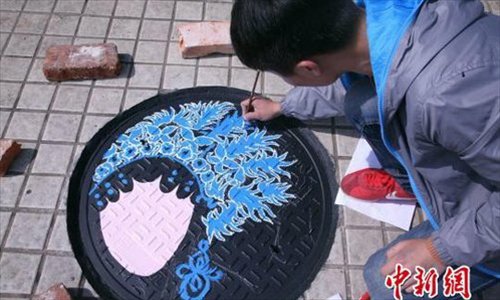 Campus canvas: Students paint manhole covers during graffiti fest ...