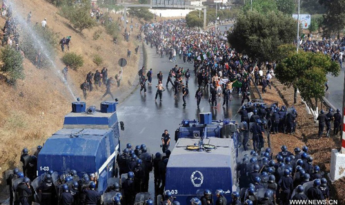 Riot police clash with community police in demonstration in Algeria ...