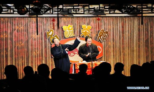Tourists enjoy cross talk in Tianjin during New Year's Day - Global Times