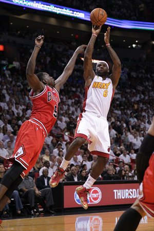 Heat keep fires burning with season-opening win - Global Times