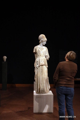 Visitors admire art works at hyper realistic sculpture exhibition in ...