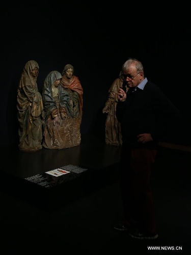 Visitors admire art works at hyper realistic sculpture exhibition in ...
