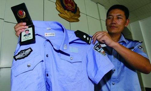 Police bust wanted con man for fake cop scam - Global Times