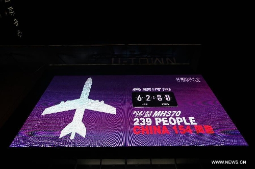 Electronic screen in Beijing shows missing time of MH370 flight ...