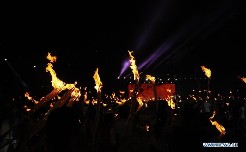 Tourists, performers mark traditional Torch Festival in SW China ...
