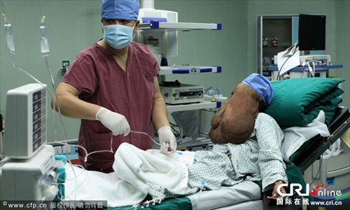 China's 'Elephant Man' undergoes surgery to remove 1.5 kilos of tumors ...