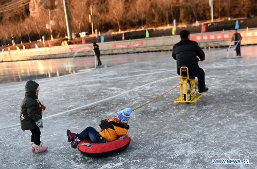 People enjoy outdoor activities on ice during winter holiday - Global Times