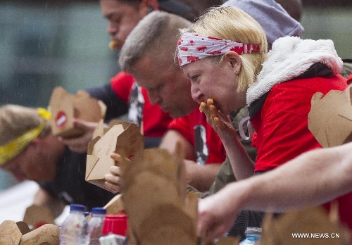 Man wins title in eating contest after gobbling 48 boxes of poutine ...