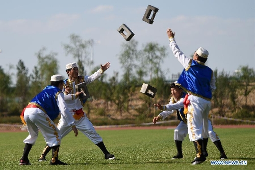 Athletes perform traditional sport event during Ethnic Games - Global Times