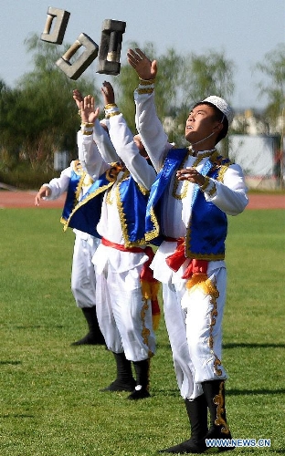 Athletes perform traditional sport event during Ethnic Games - Global Times