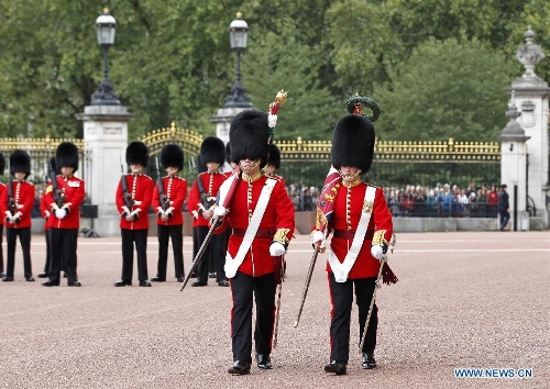 British Royal Guards attend changing ceremony at Buckingham Palace ...