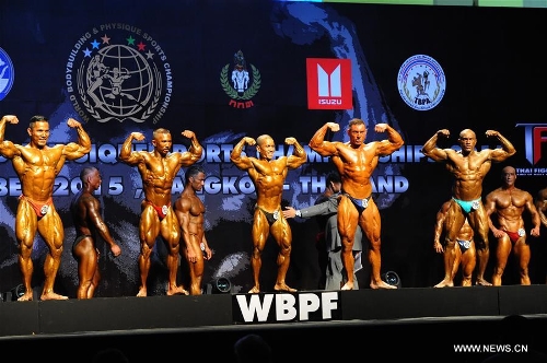 Competitors flex their muscles during WBPF Championship 2015 - Global Times
