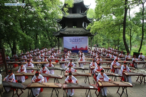Teenagers play Chinese instrument Zheng in China's Hubei - Global Times