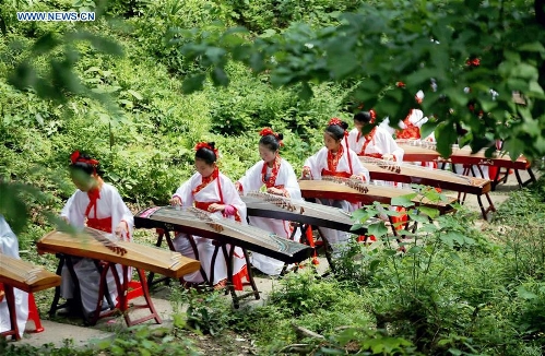 Teenagers play Chinese instrument Zheng in China's Hubei - Global Times