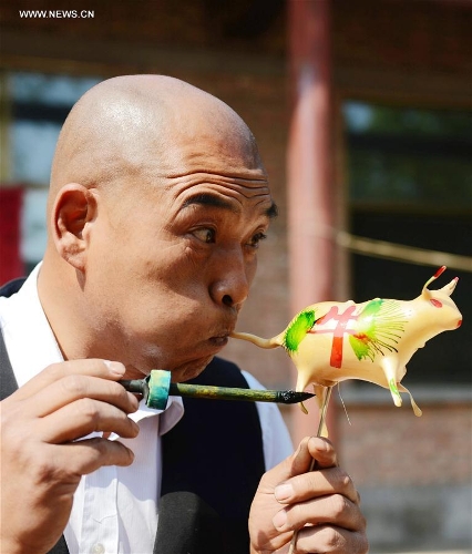 Craftsman creates sugar figures in N China - Global Times