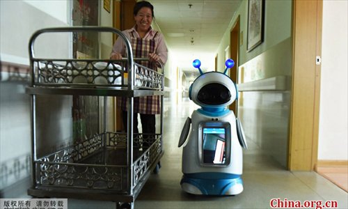 Robots serve elderly in E China nursing home - Global Times