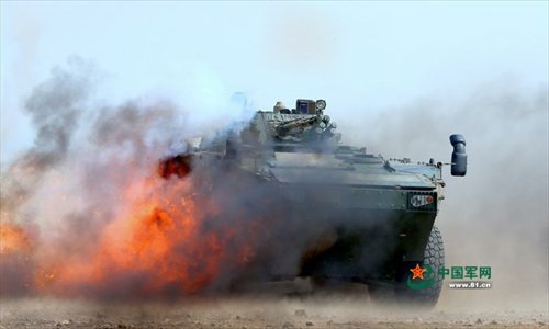 Soldiers driving eight-wheeled infantry fighting vehicles in combat ...