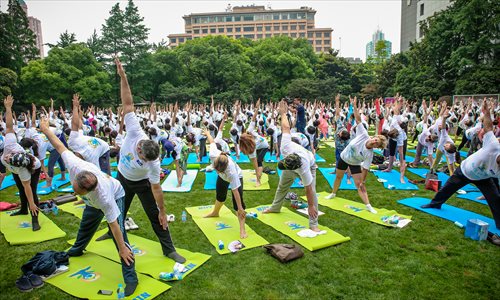 Yoga lovers in Shanghai gather to celebrate ancient Indian tradition ...