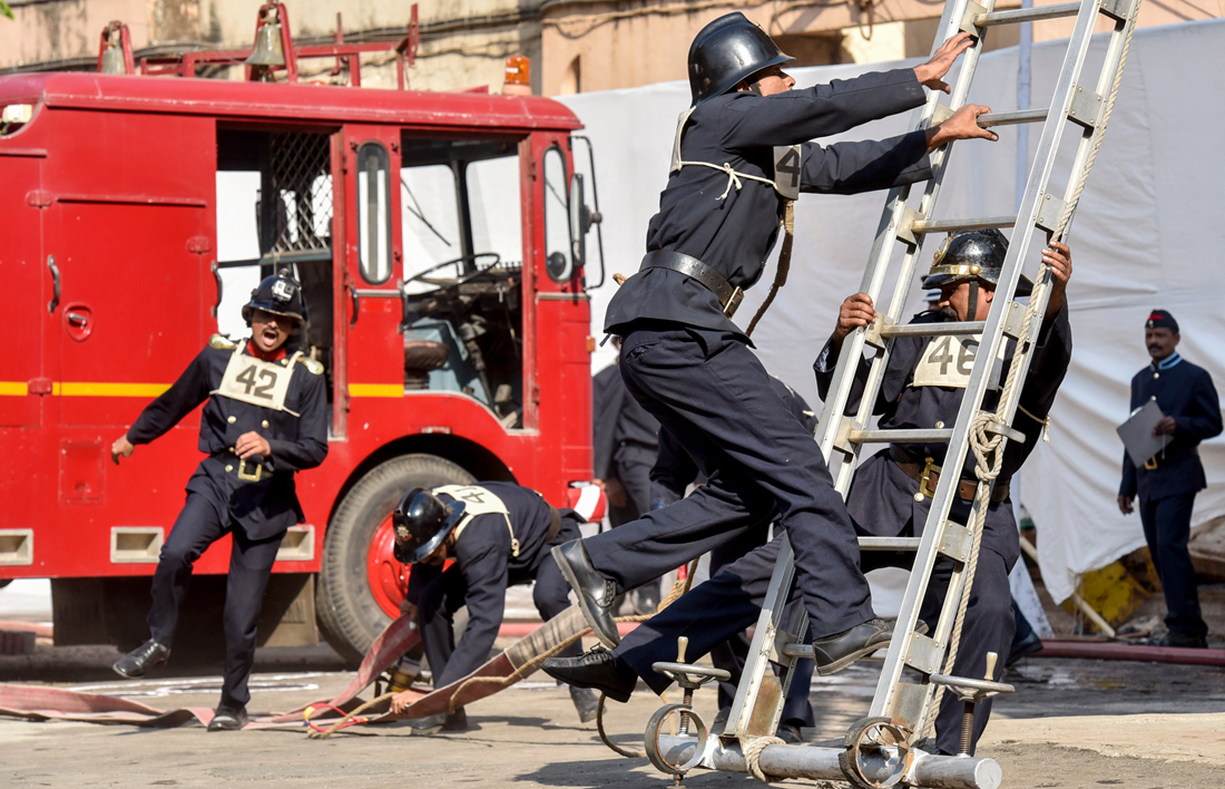 Firemen show off their skill at annual drill competition held in India ...
