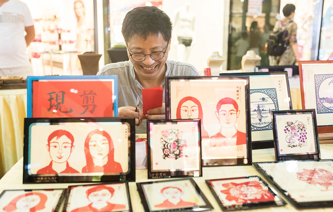 Chinese paper-cutting master personalizes artwork for customers ...