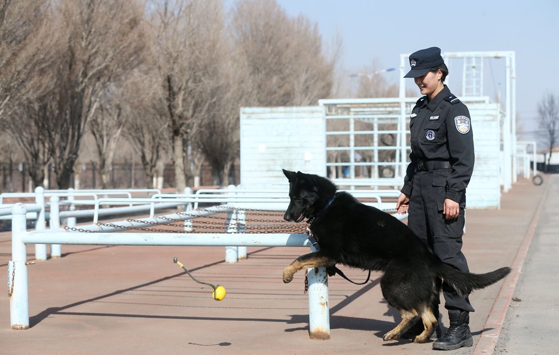 A female special police keeps to the front line against terror with a ...