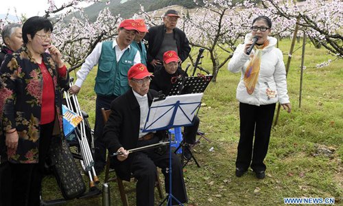 Elderly people enjoy spring view with volunteers in China's Zhejiang ...