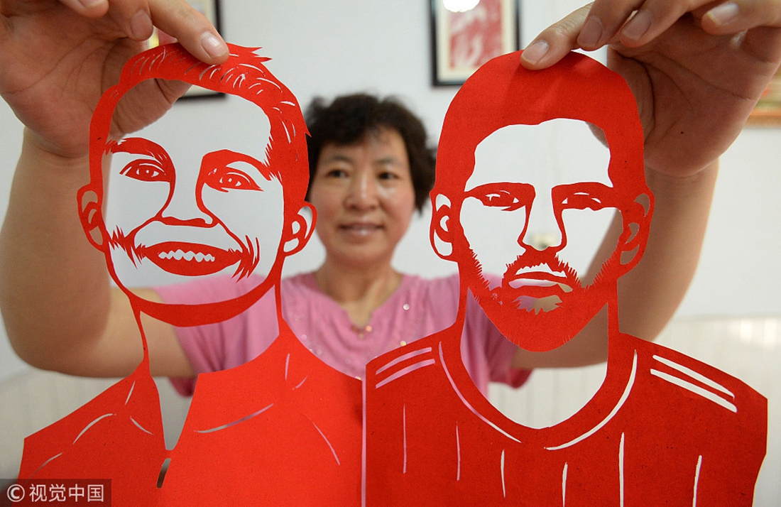 Chinese paper-cutting artist creates cutouts of football stars ahead of ...