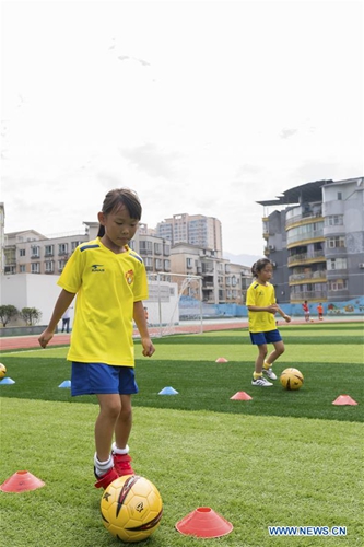 Girl students practice football in SW China's Guizhou - Global Times