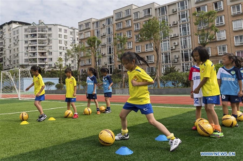 Girl students practice football in SW China's Guizhou - Global Times
