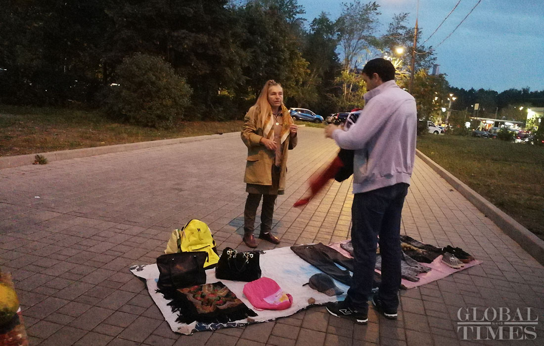 Russian women sell homemade beverages, second-hand clothes in Moscow ...