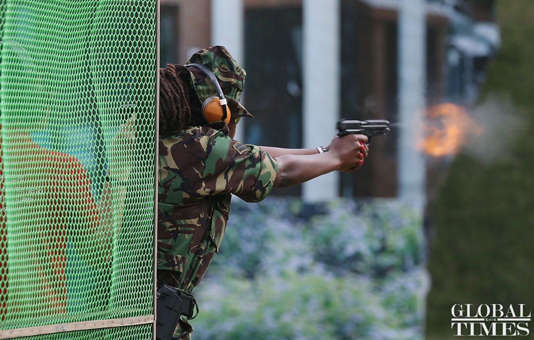Participants in World Police Pistol Shooting Competition try to rule ...