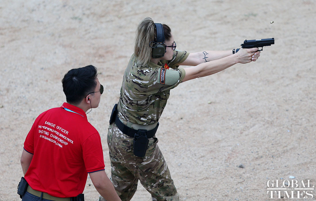 Participants in World Police Pistol Shooting Competition try to rule ...