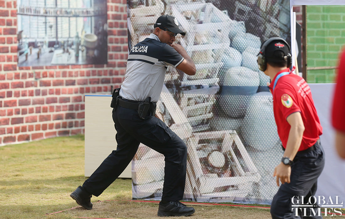 Participants in World Police Pistol Shooting Competition try to rule ...