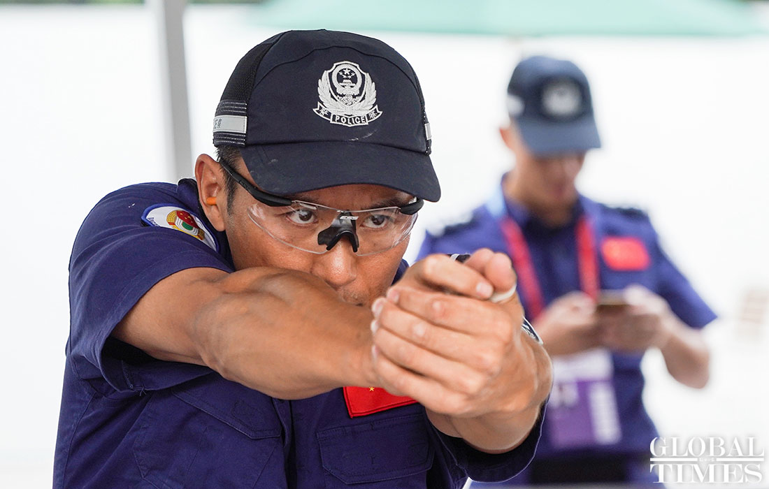 Participants in World Police Pistol Shooting Competition try to rule ...