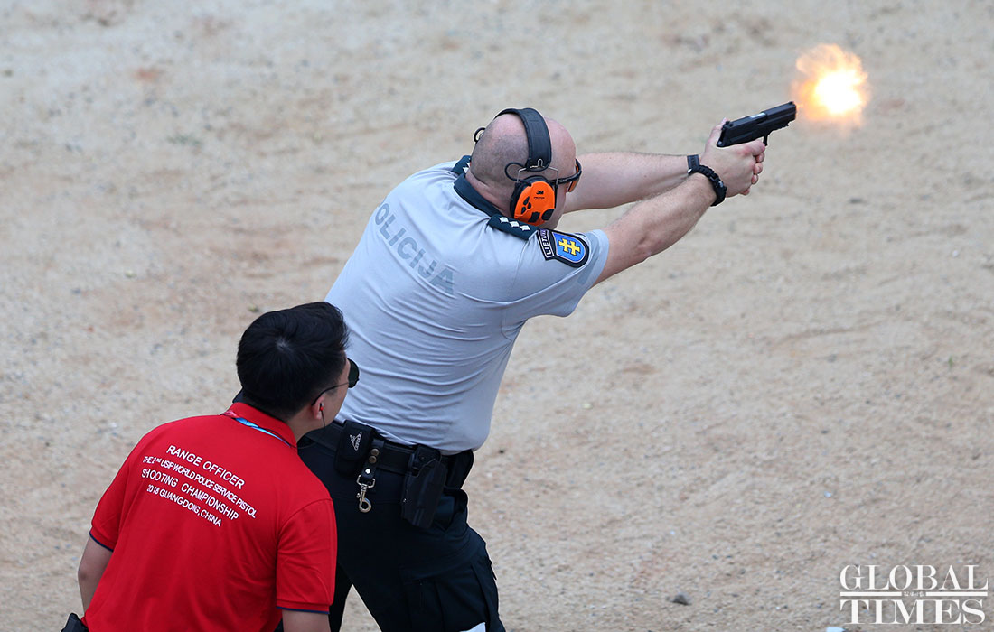 Participants in World Police Pistol Shooting Competition try to rule ...