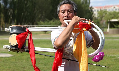 Governments help Xinjiang preserve traditional music - Global Times
