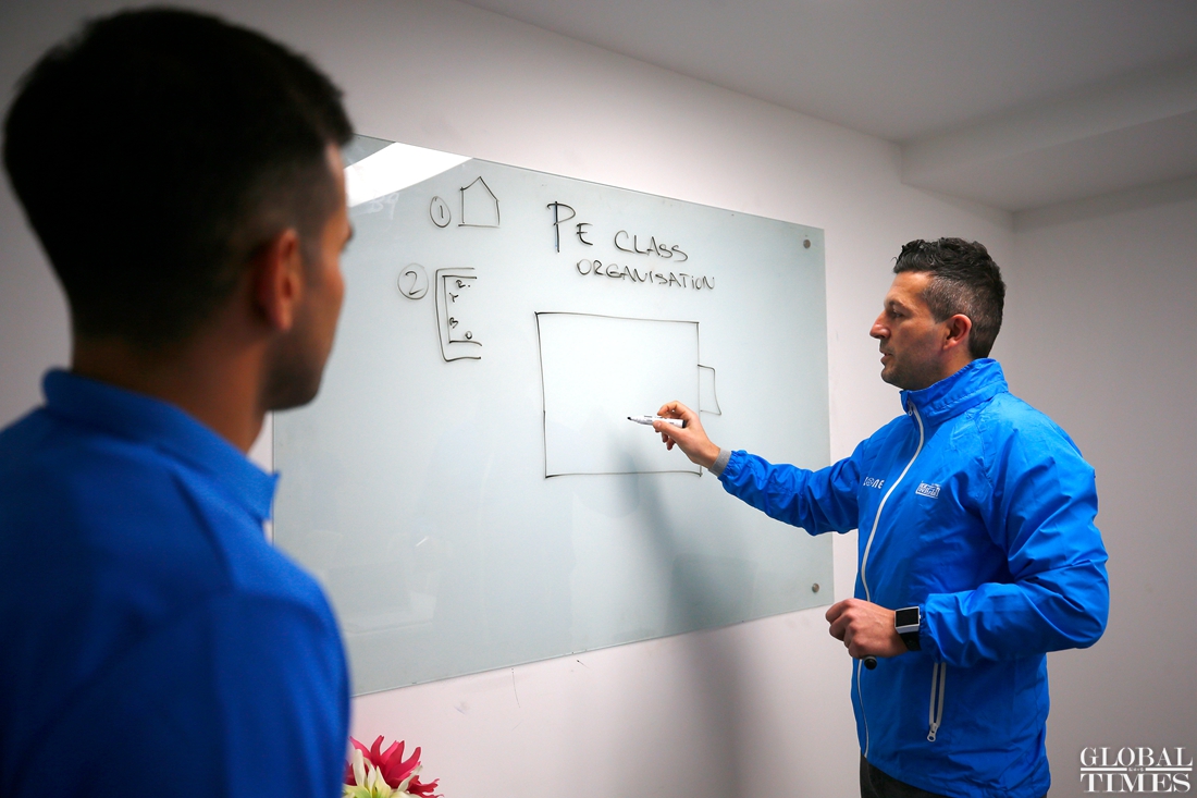 Foreign coaches teach football classes to students at schools in ...