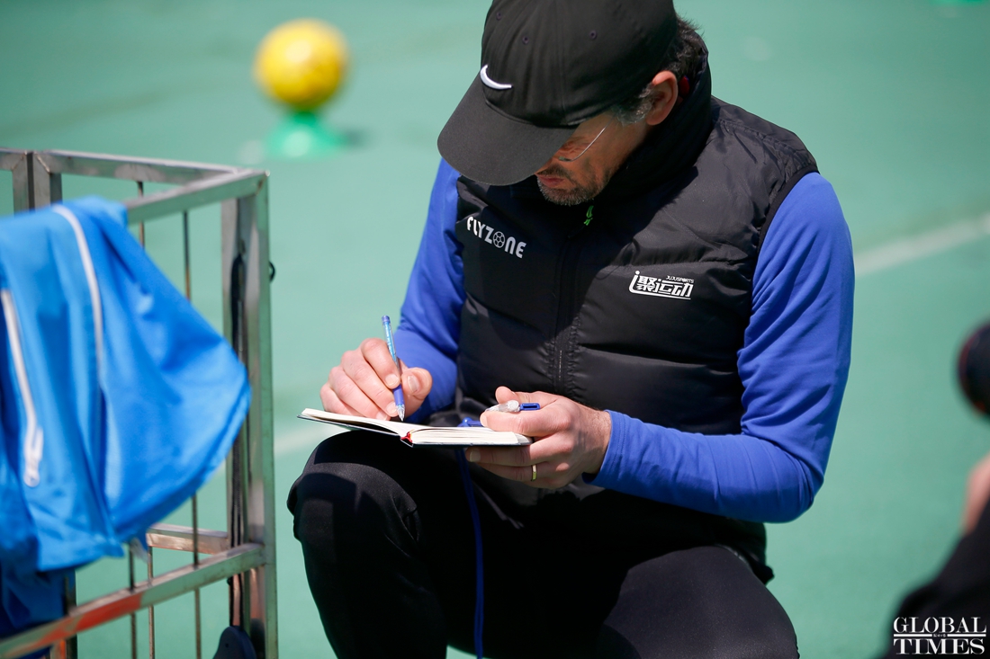 Foreign coaches teach football classes to students at schools in ...
