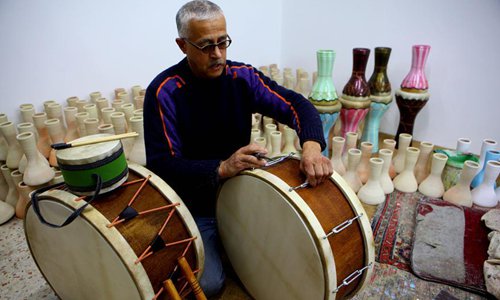 Palestinian artisan produces musical instruments in West Bank city of ...