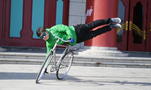 Man displays cycling stunts in Changchun - Global Times
