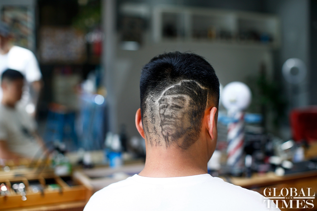 The artist in haircut - Global Times