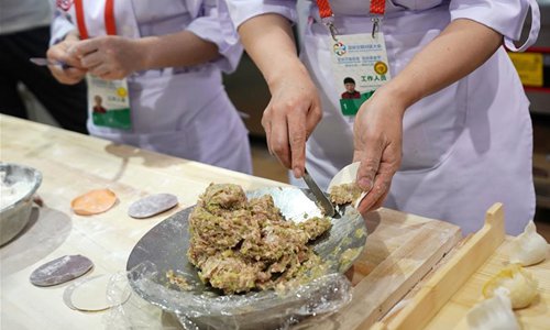 Cooks make delicious food during Asian Cuisine Festival in Beijing ...