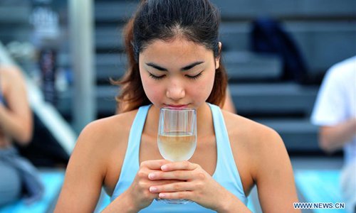 Yoga enthusiasts attend sunrise wine yoga class in Bangkok - Global Times