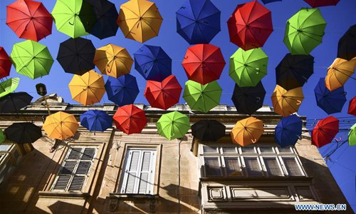 Scenery of "Umbrella Street" spectacle in Zabbar, Malta - Global Times