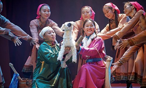 Traveling art troupe perform play blending Mongolian folk songs, dances ...