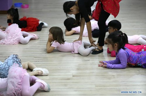 Children practice ballet dance at Myanmar Ballet School in Yangon ...