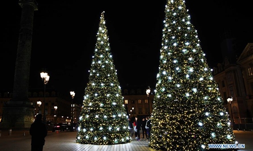 Paris decorated with Christmas trees and decorations for festival ...