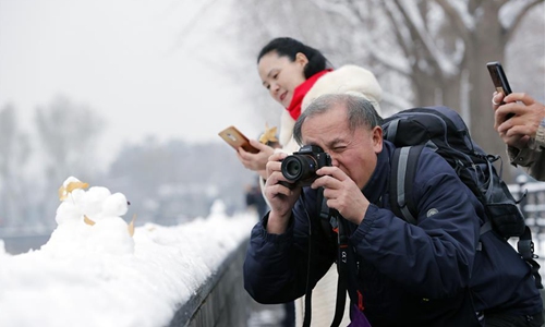 Beijing embraces timely first snow - Global Times